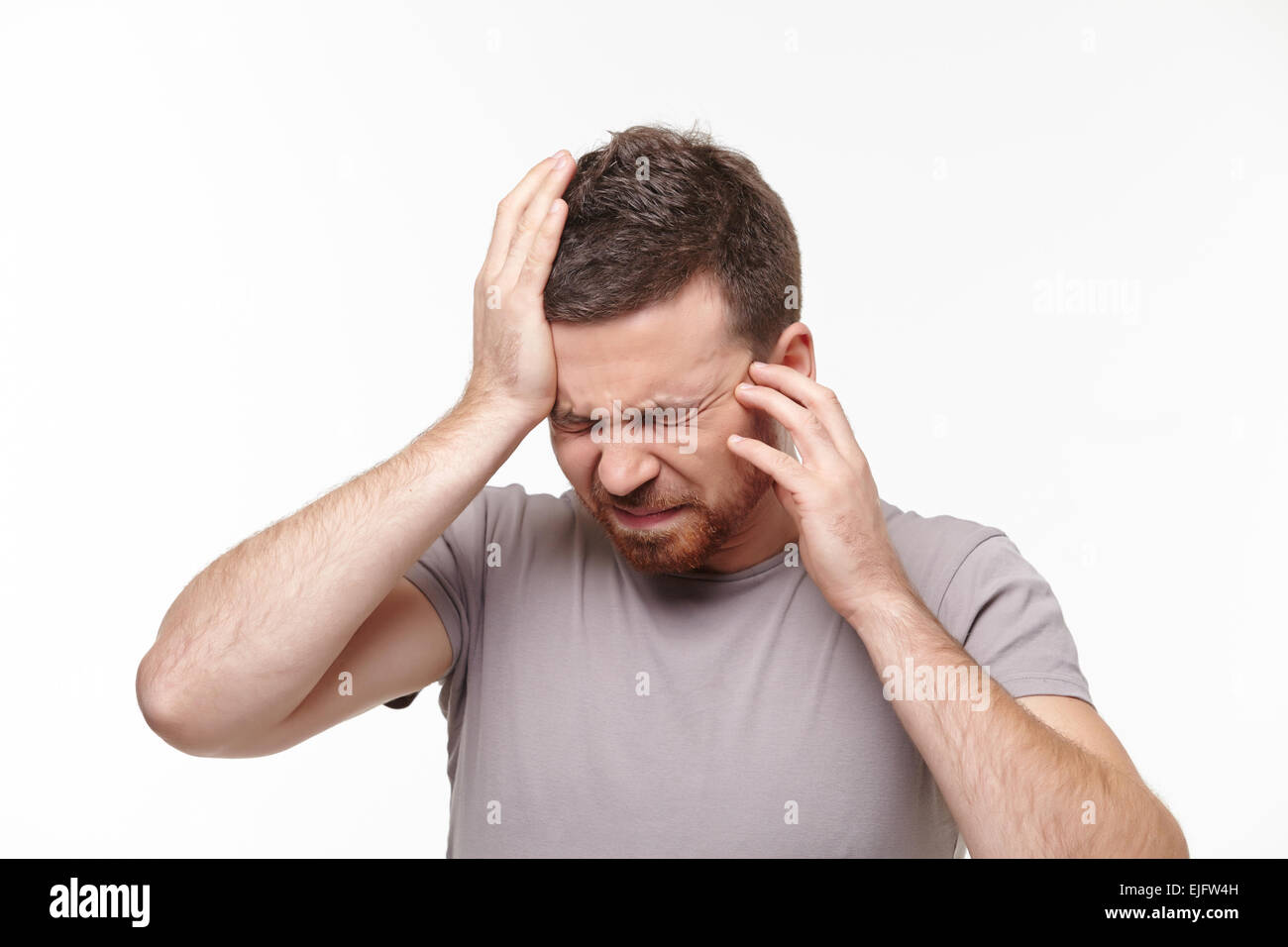 the young men have a headache Stock Photo - Alamy