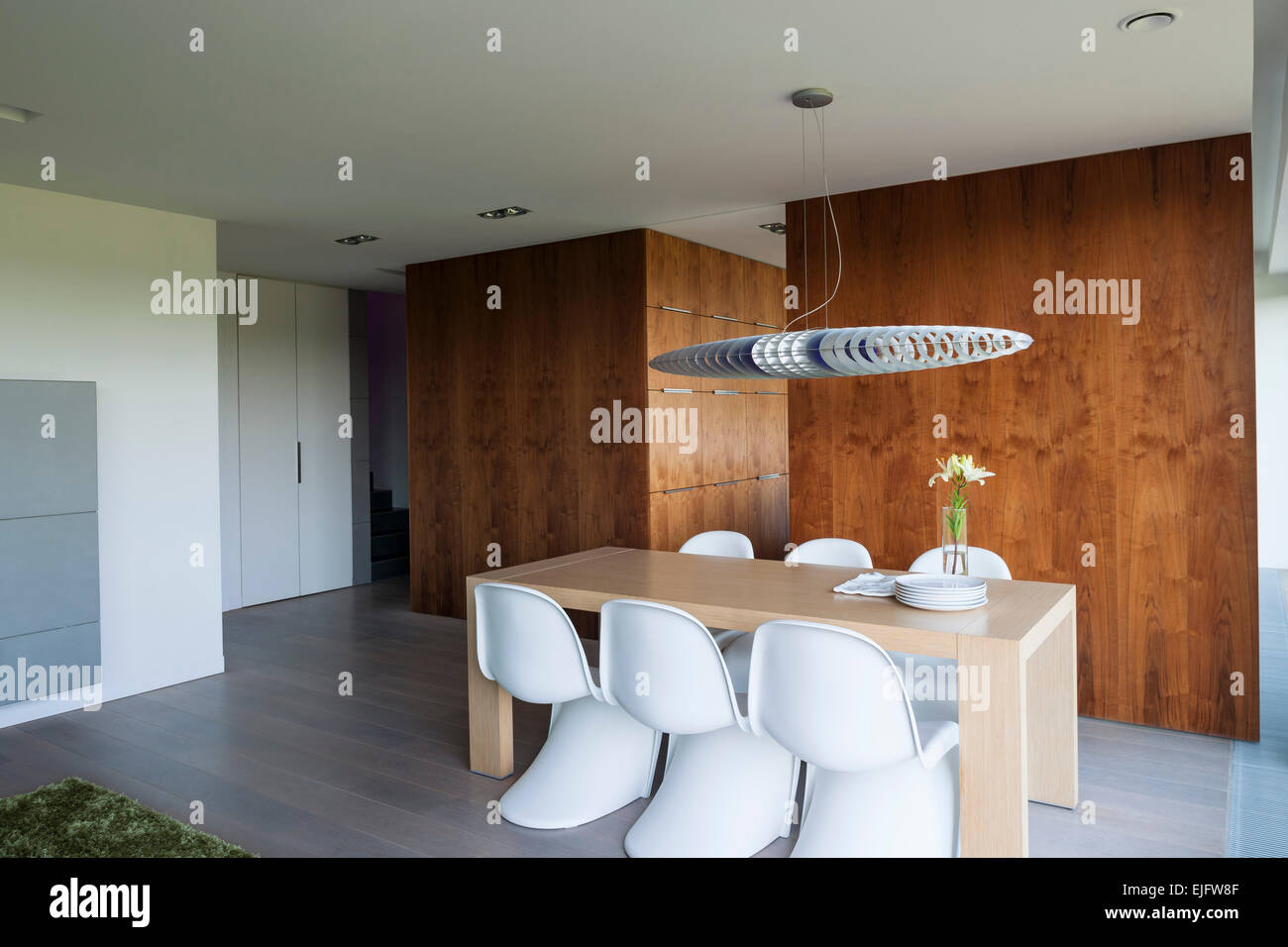Dining area featuring Pantone chairs and modular timber furniture ...