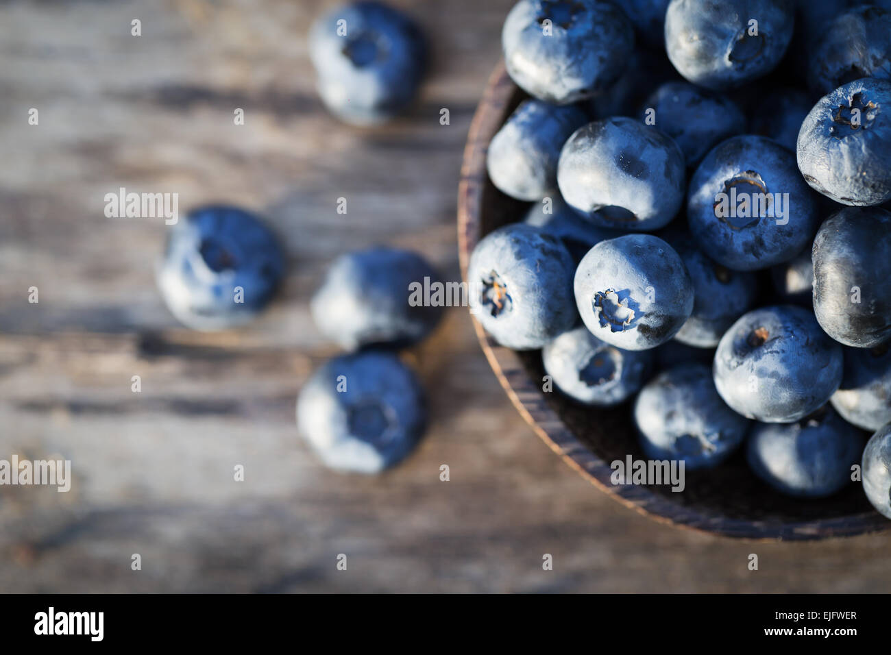 Fresh sweet tasty blueberries on a wooden background Stock Photo - Alamy