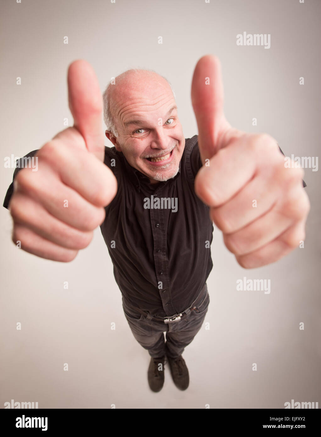 happy man and thumbs up in wideangle closeup Stock Photo - Alamy