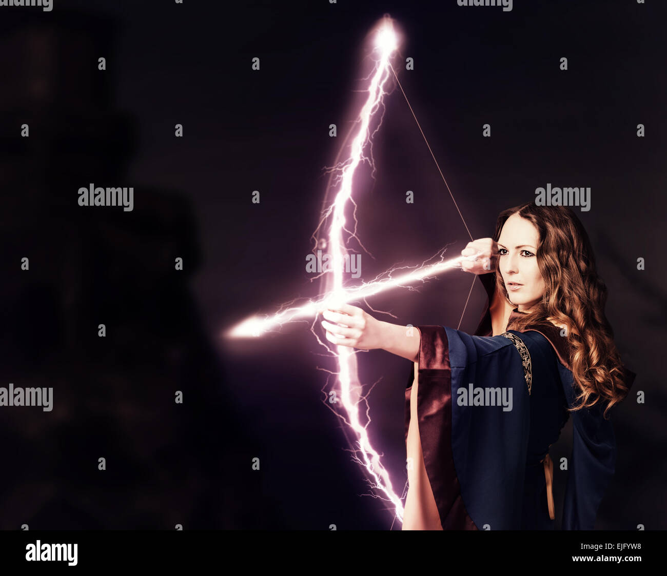 Beautiful fairy woman archer with a magic bow at night on dark ...