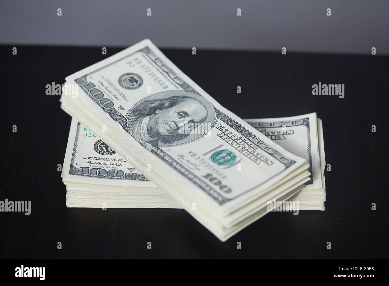 stacks of money Stock Photo - Alamy