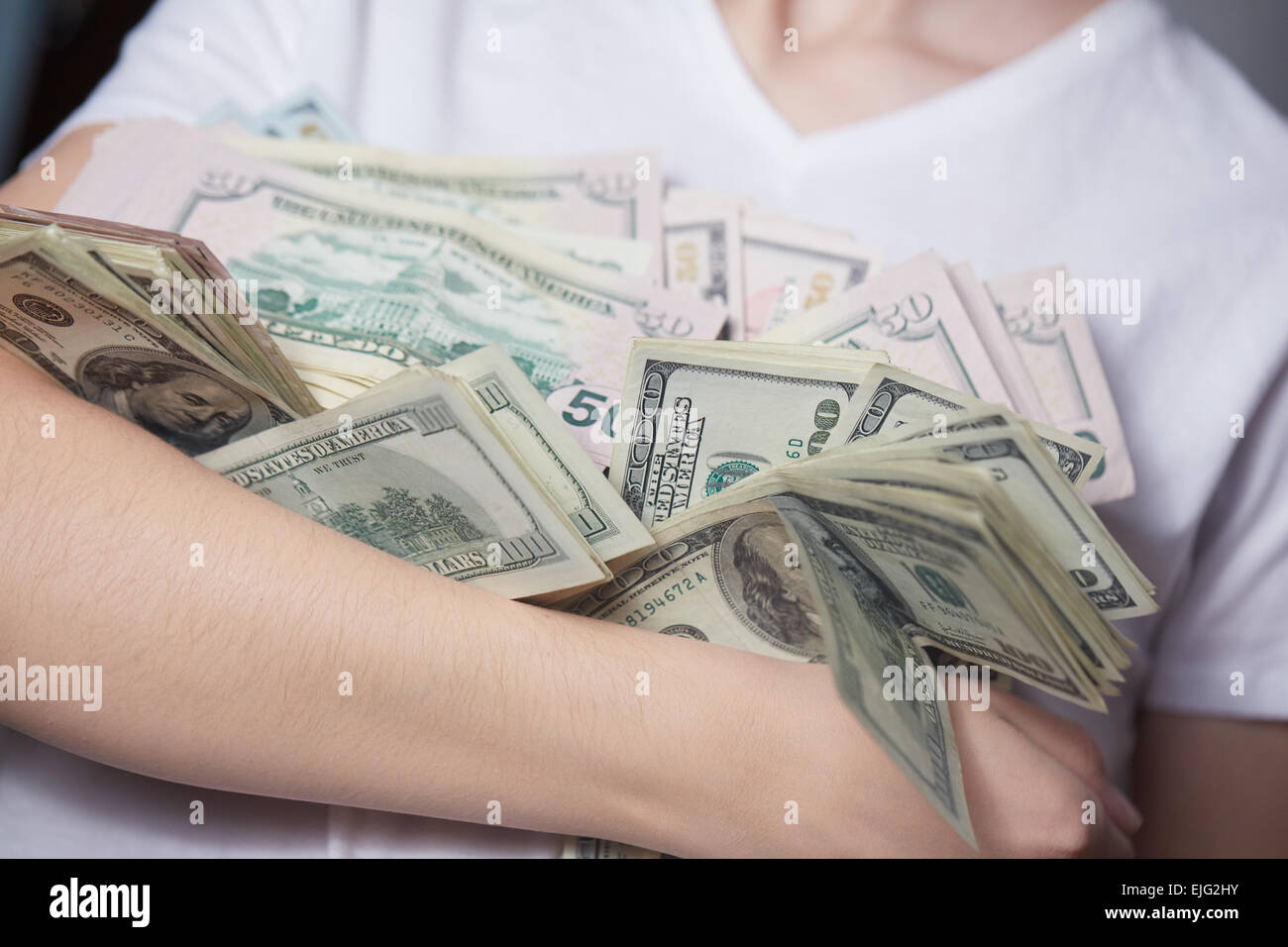 Money in female hands Stock Photo - Alamy