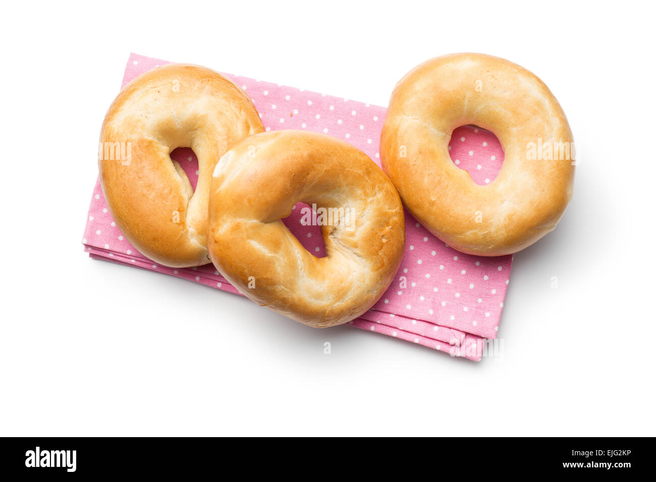 three bagels with napkin on white background Stock Photo - Alamy
