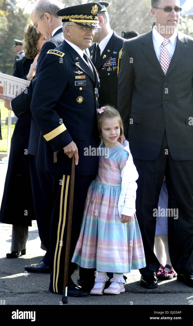 U.S. Army Gen. George W. Casey's granddaughter clings to his leg prior ...