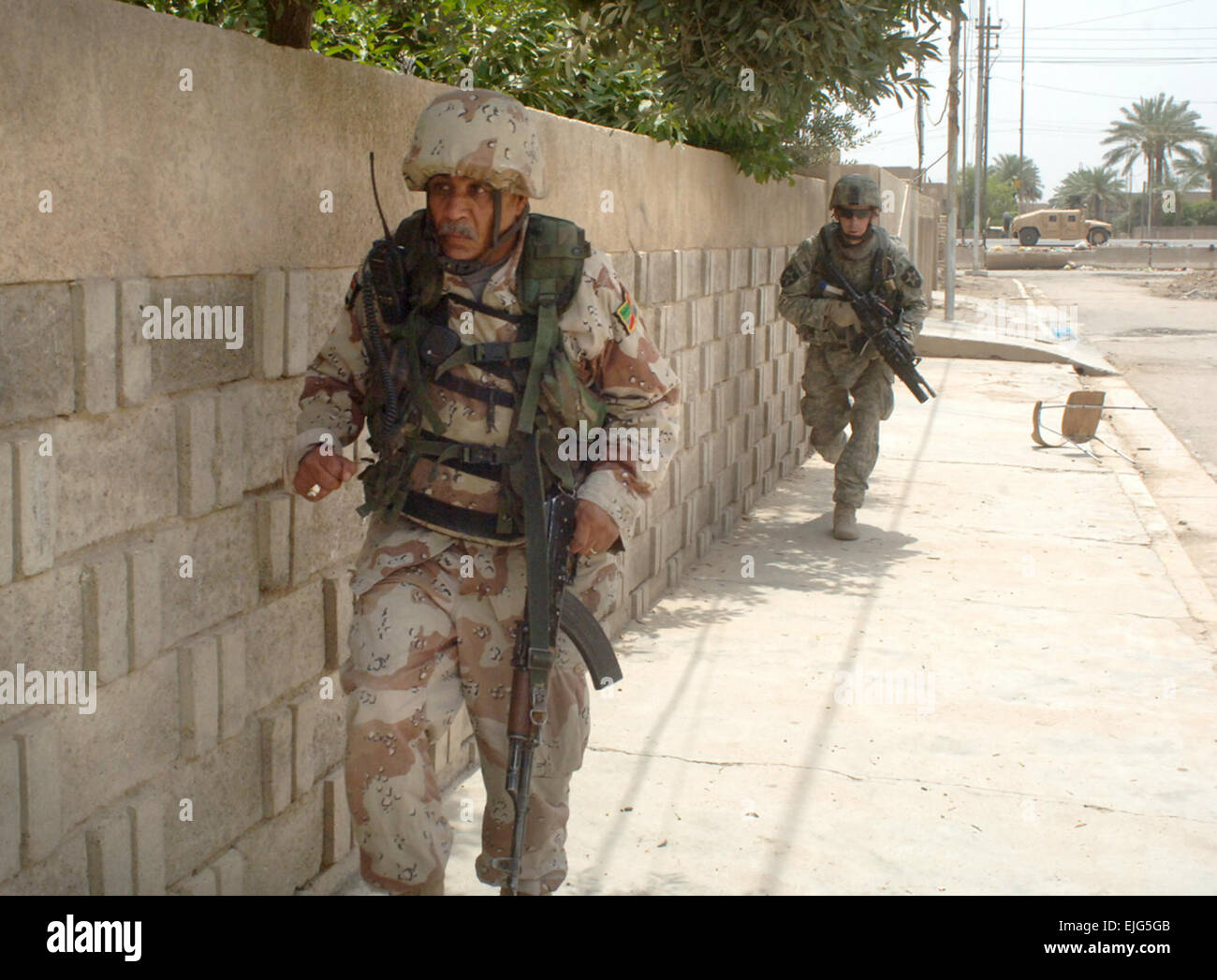 U.S. Army Sgt. Jesse McDowell, rear, and an Iraqi army soldier from 3rd ...