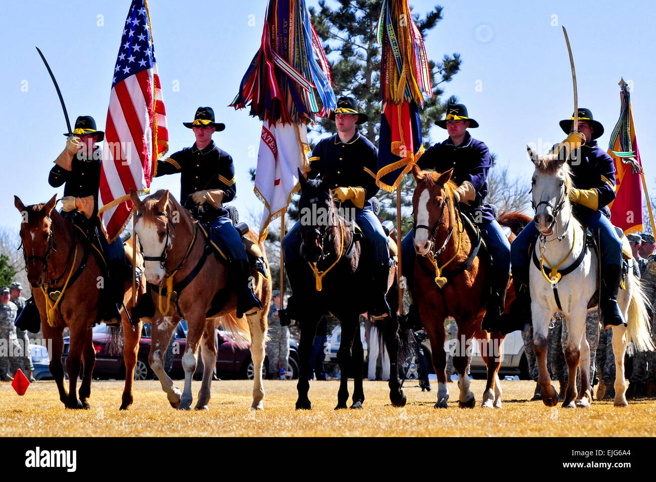 The Fort Carson Mounted Color Guard salute the colors during a change ...