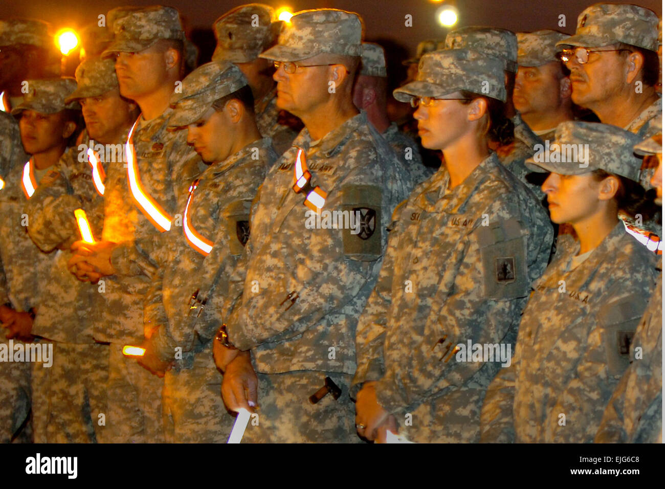 Soldiers attend a chemical light vigil held at the North Fort Hood ...
