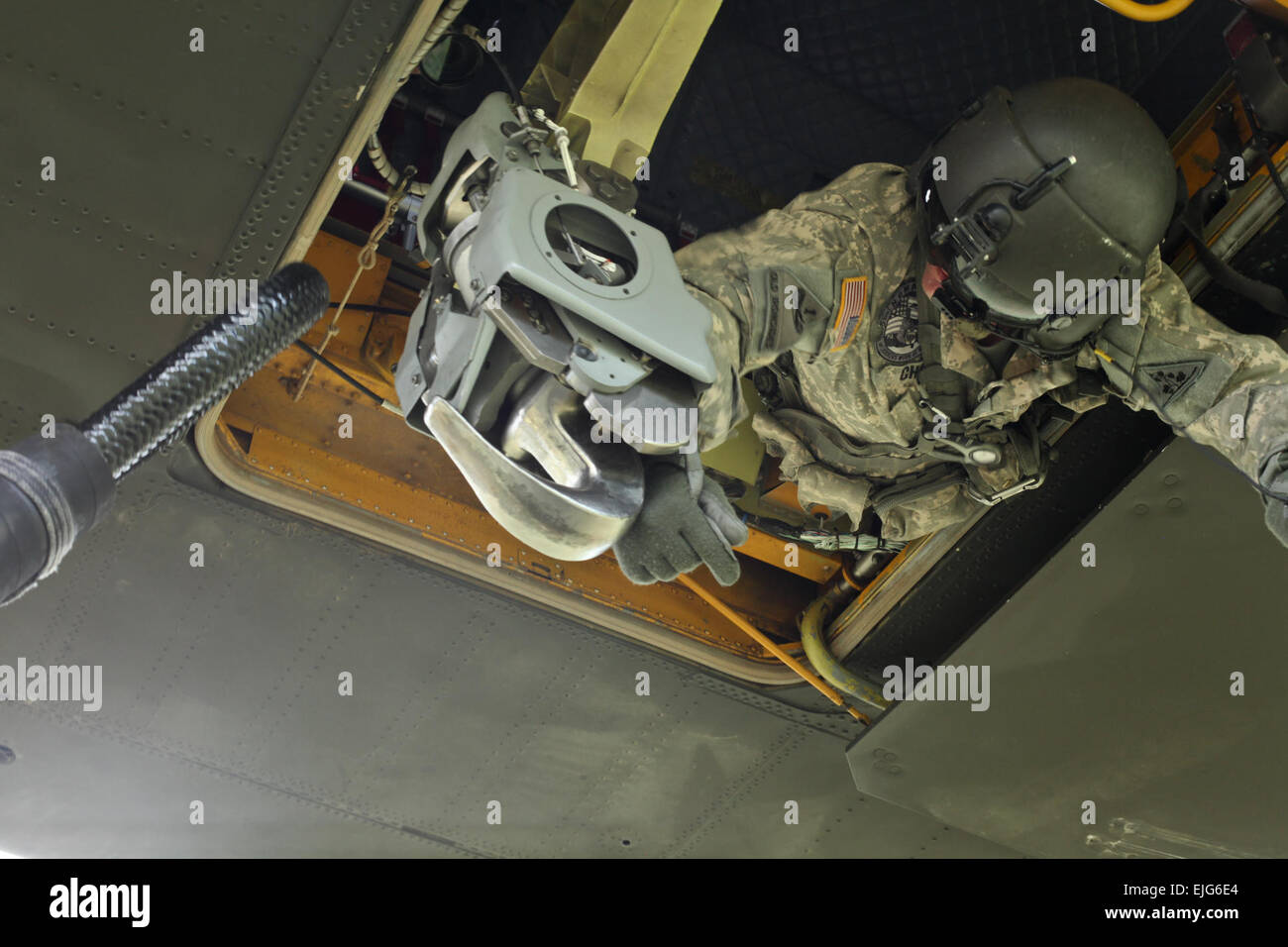 A U.S. Army CH-47 Chinook crew chief receives a high-mobility multi ...