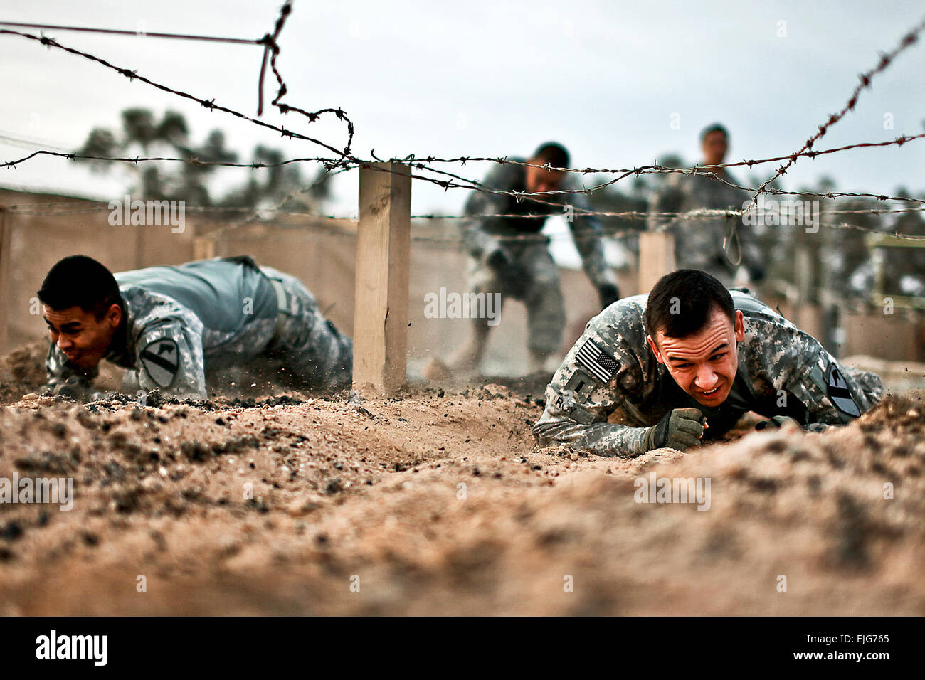 During a team-building challenge, U.S. Army 1st Lt. Alan Roy, right ...