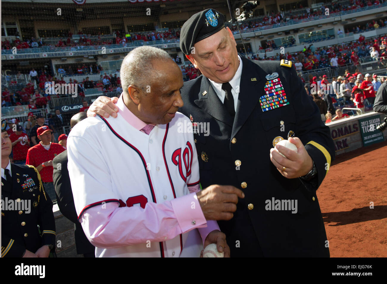 U.S. Army Chief of Staff Gen. Raymond T. Odierno shows a baseball to ...