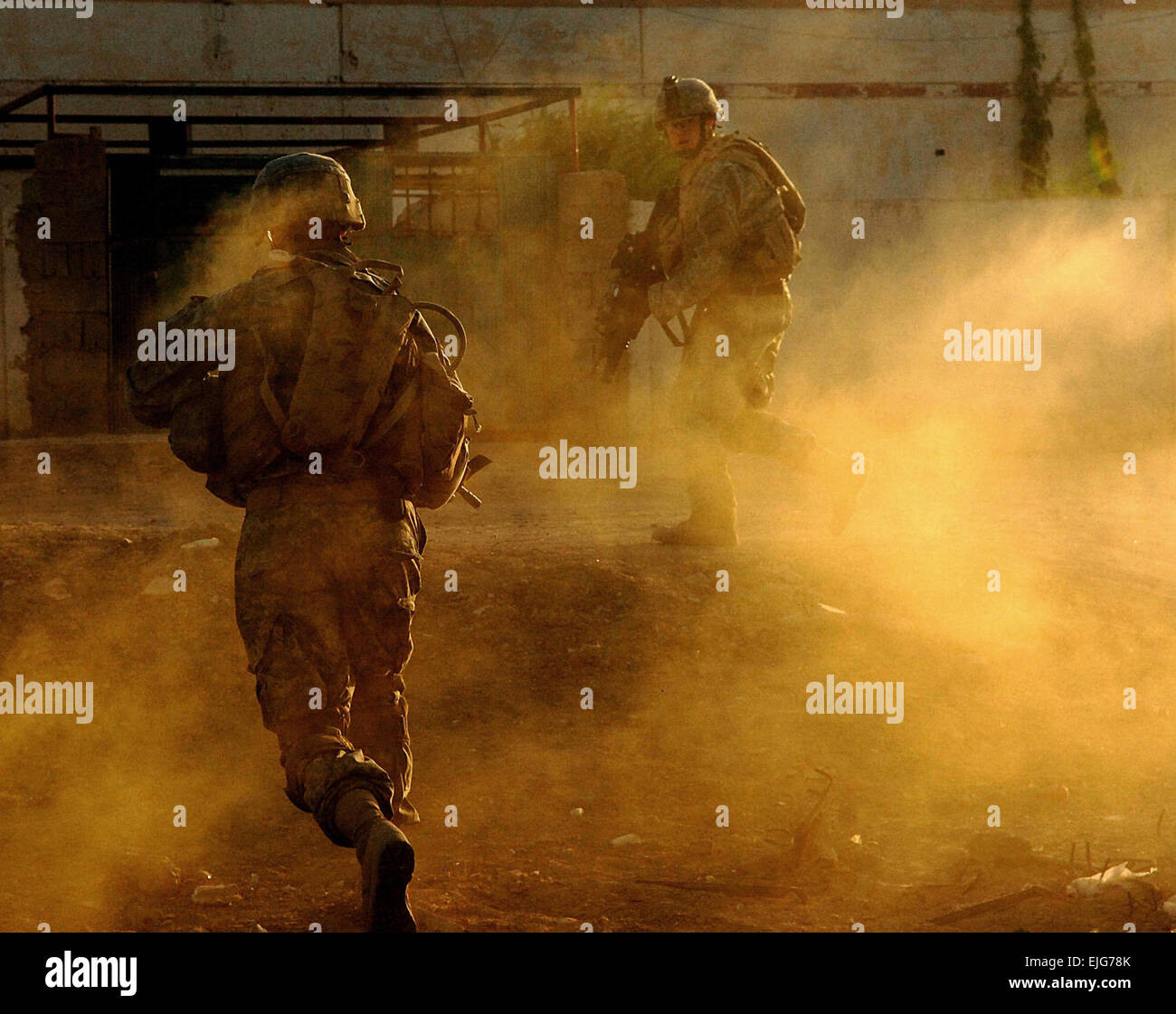 Soldiers move to their next objective during a morning raid in the ...