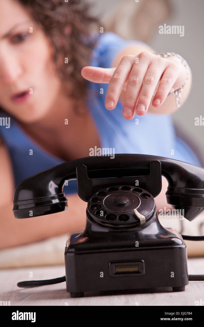 young woman worried by a telephone call done or to be done Stock Photo ...