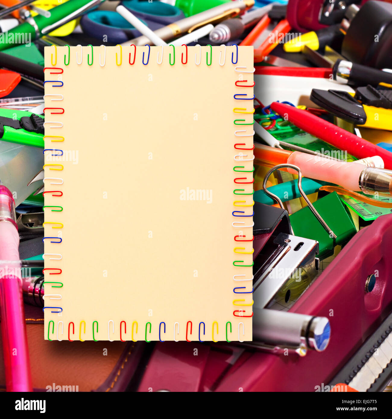 illustration of a sheet of A4 paper in a frame of colored paper clips ...