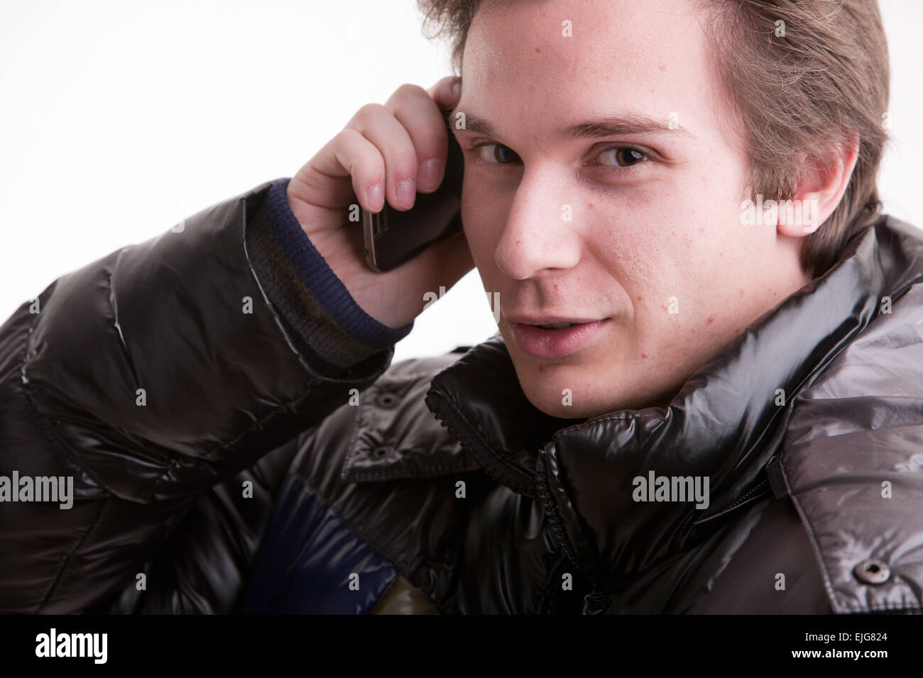 portrait oaf a goold looking young man phoning on a mobile phone Stock ...