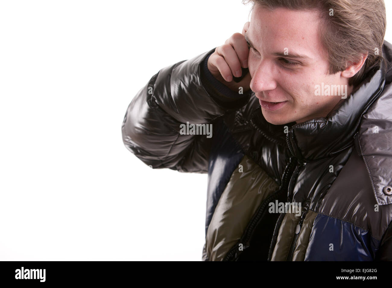 portrait oaf a goold looking young man phoning on a mobile phone Stock ...