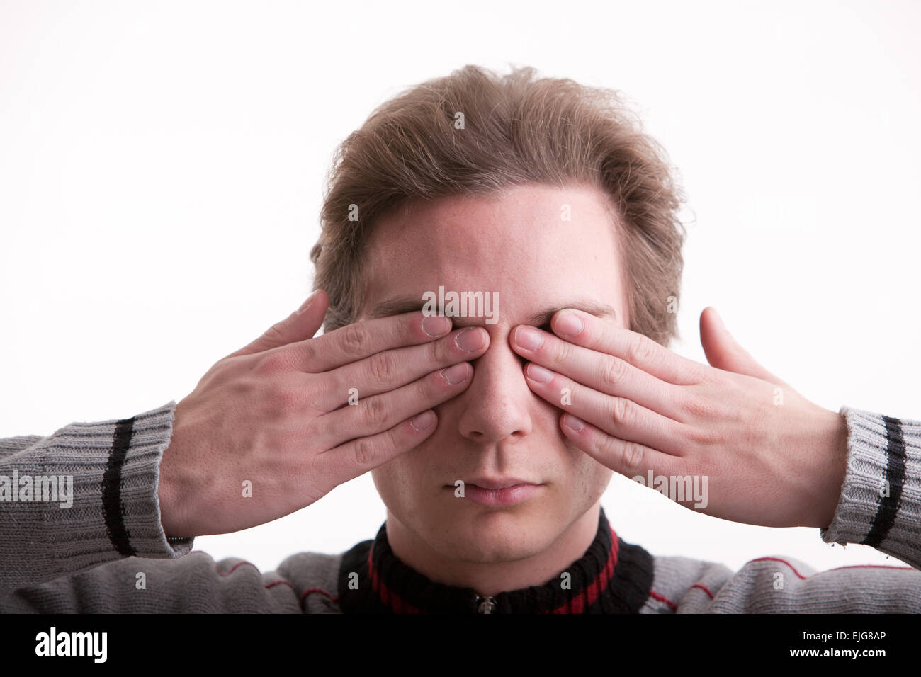 man covering his eyes with his hands showing he can't see (hands on ...
