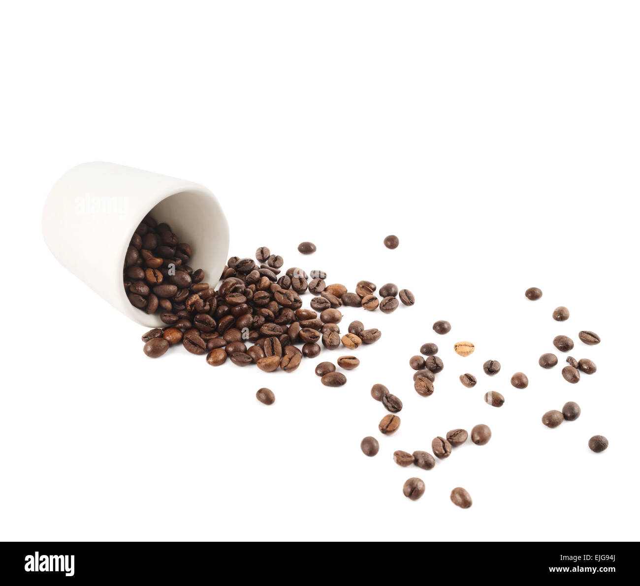 Spilled coffee beans from the cup isolated Stock Photo - Alamy