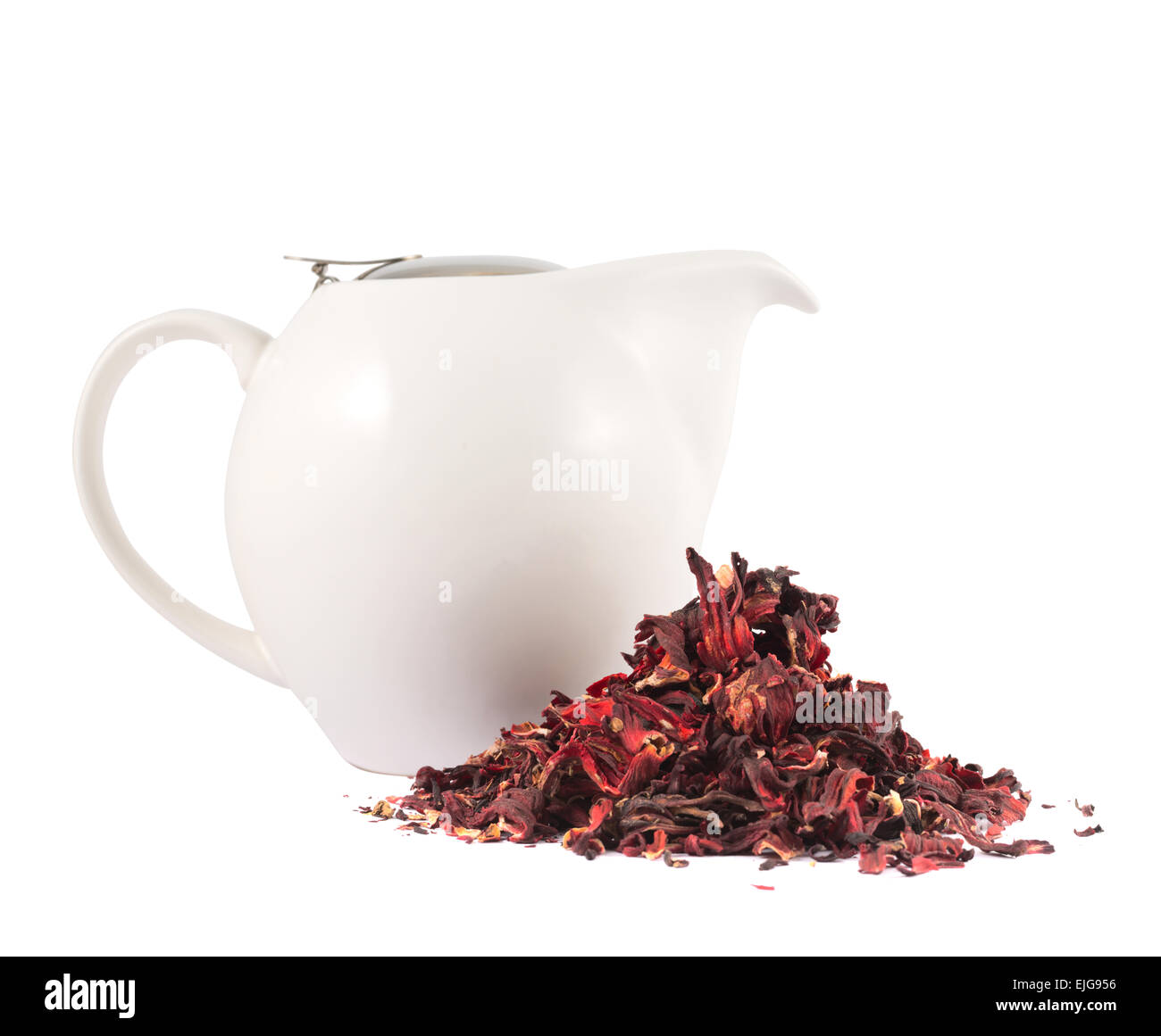 Ceramic teapot next to pile of tea isolated Stock Photo - Alamy