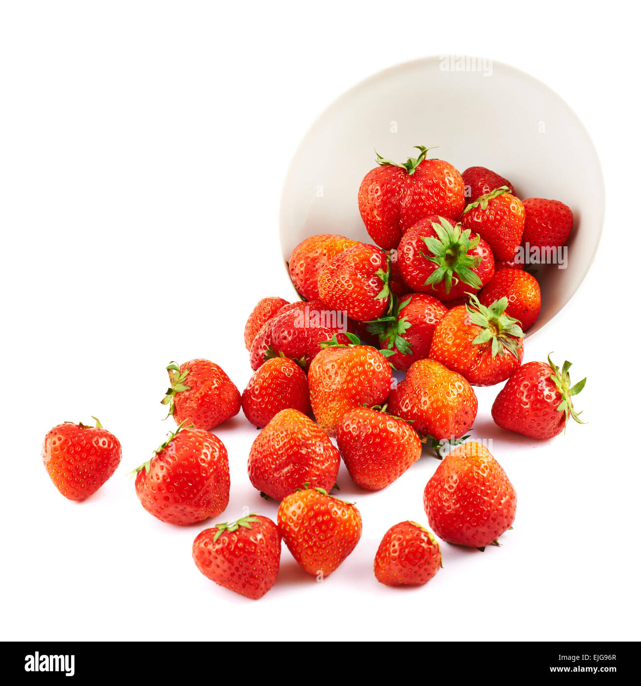 Scattered strawberries in a bowl Stock Photo - Alamy