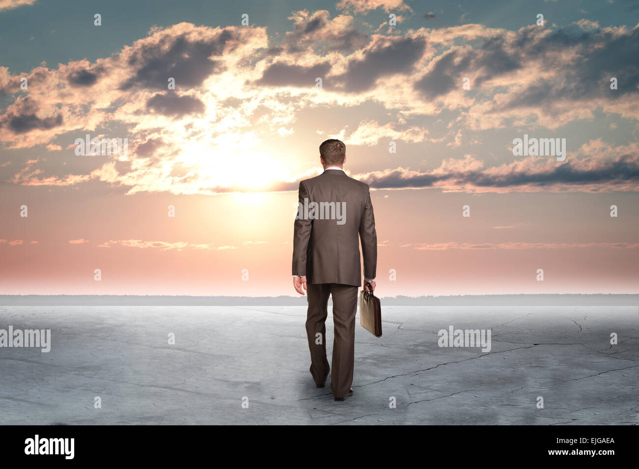 Concrete fissures surface. Man standing back. Sunset Stock Photo - Alamy