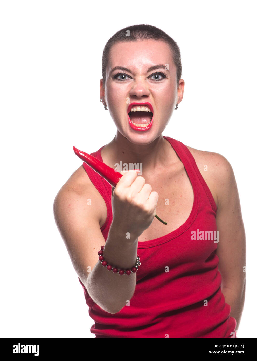 Aggressive Woman with chili pepper on white background Stock Photo - Alamy