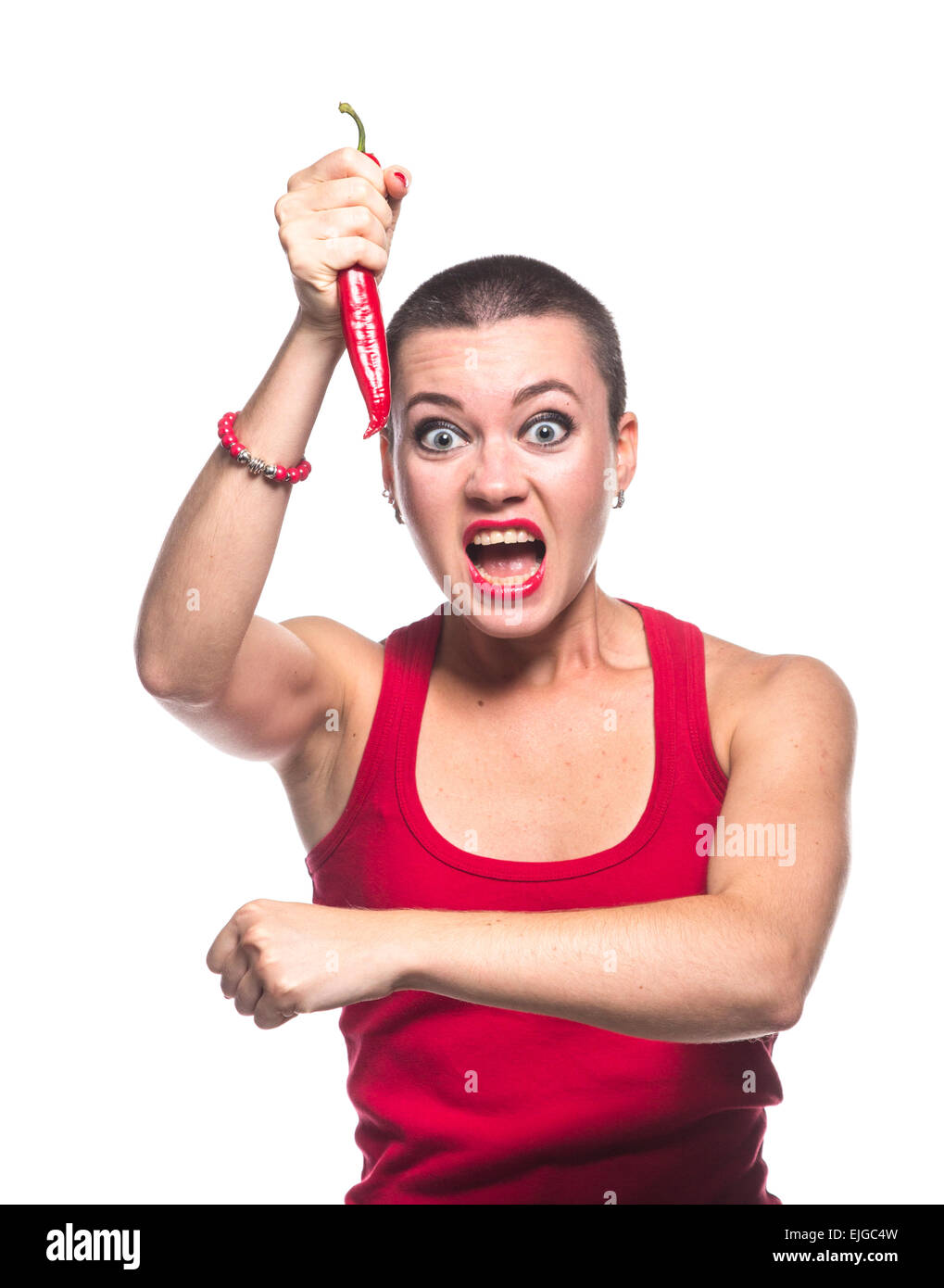 Aggressive Woman with chili pepper on white background Stock Photo - Alamy