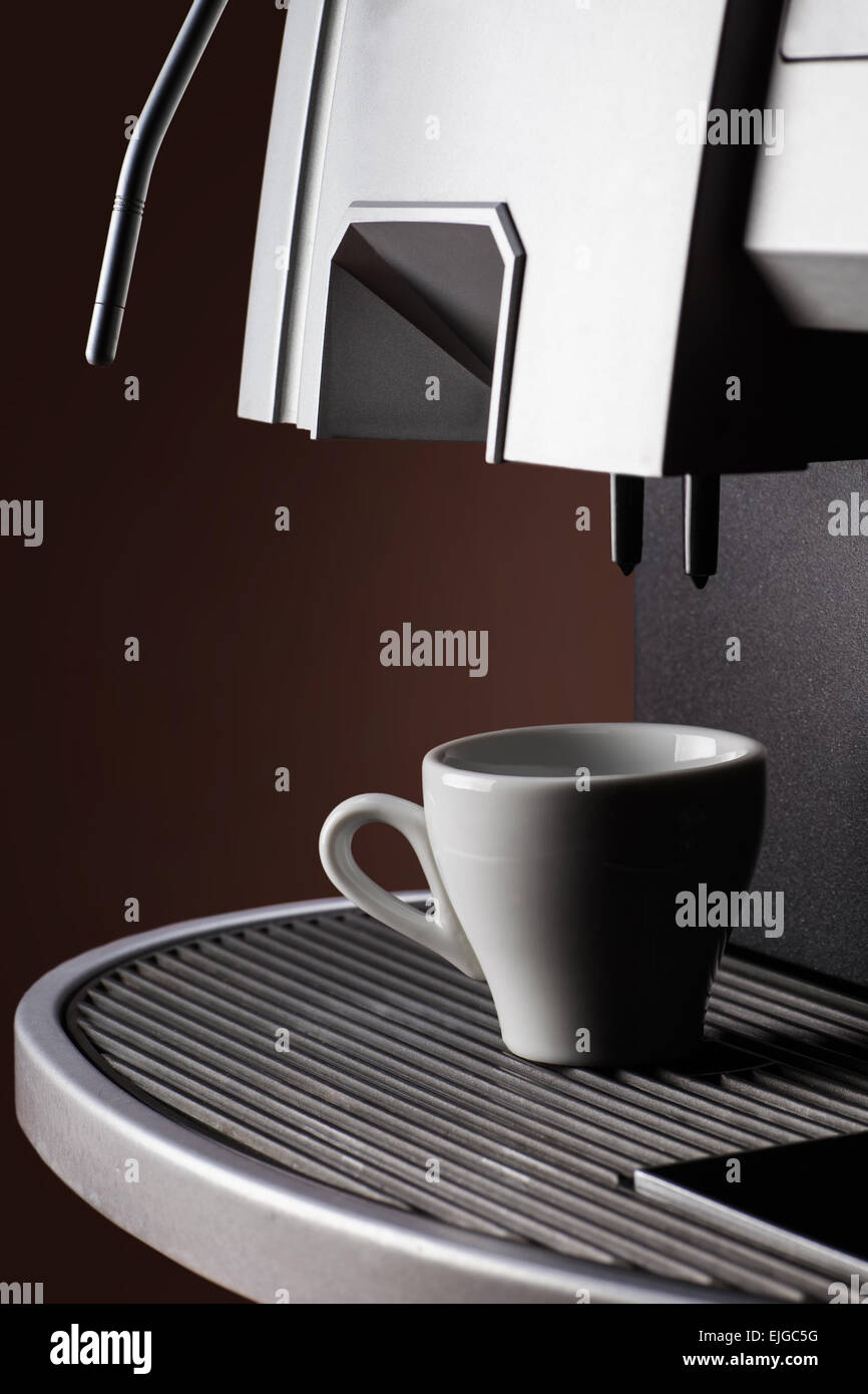 coffee machine and cup, hot beverage preparation Stock Photo - Alamy