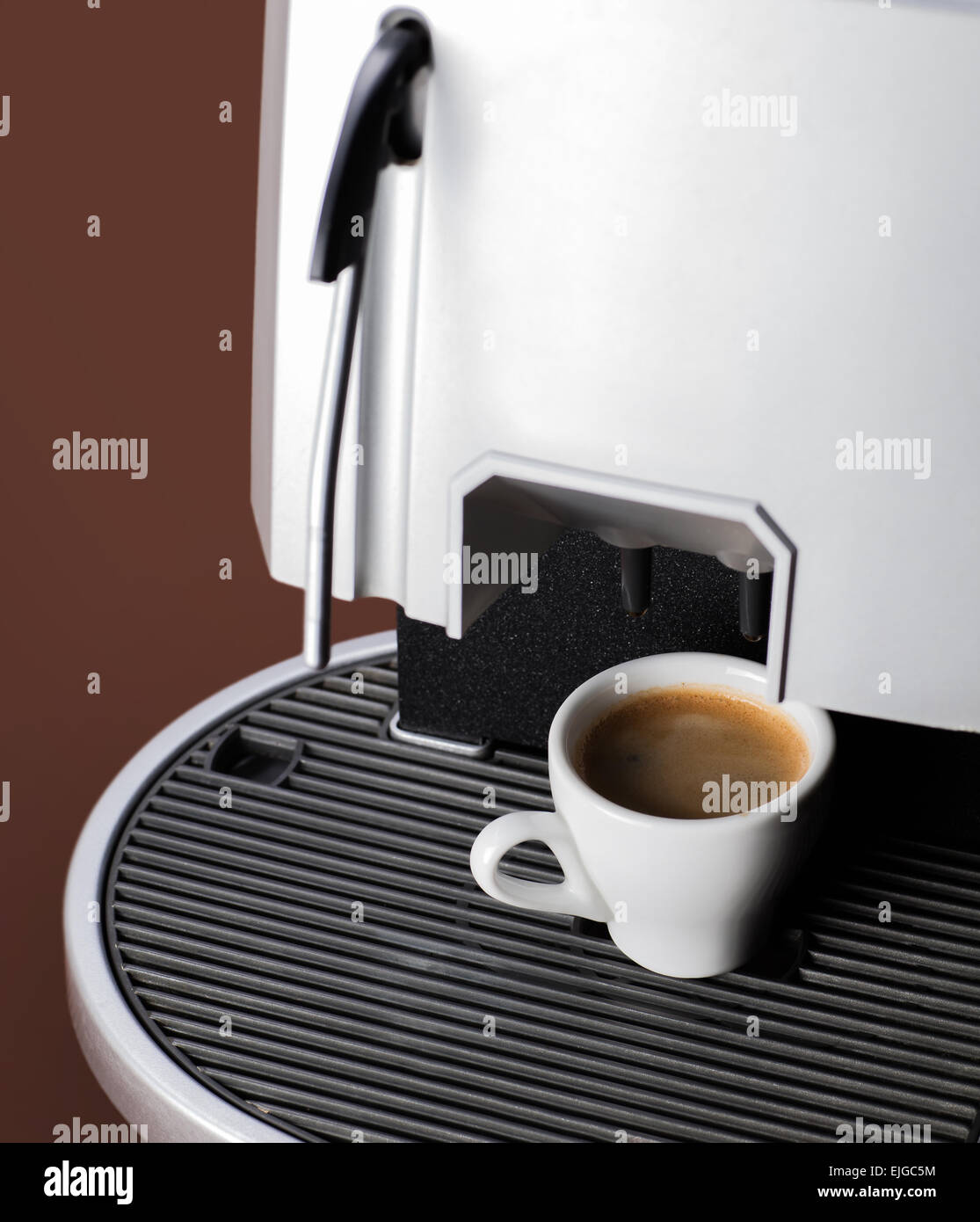 Standing at coffee machine hi-res stock photography and images - Alamy