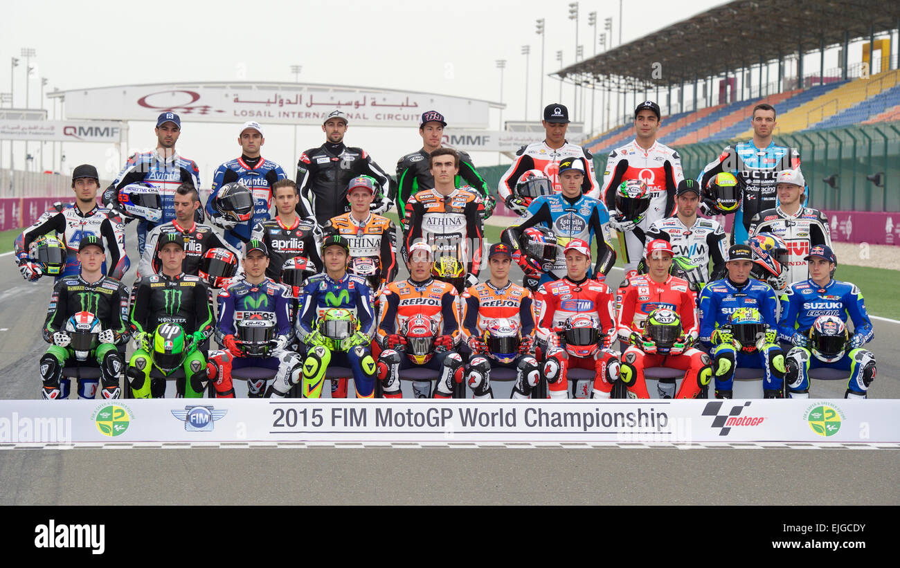 Losail Circuit, Qatar. 26th March, 2015. MotoGP riders pose for a class ...
