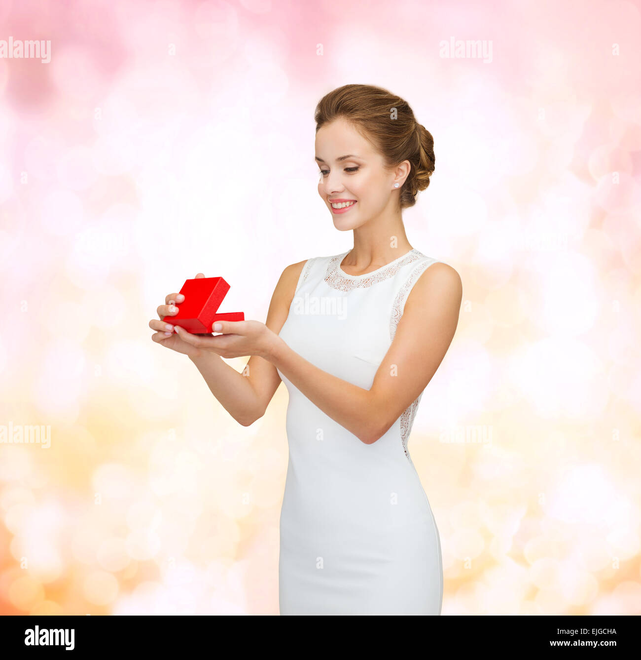 Woman holding pink box hi-res stock photography and images - Alamy