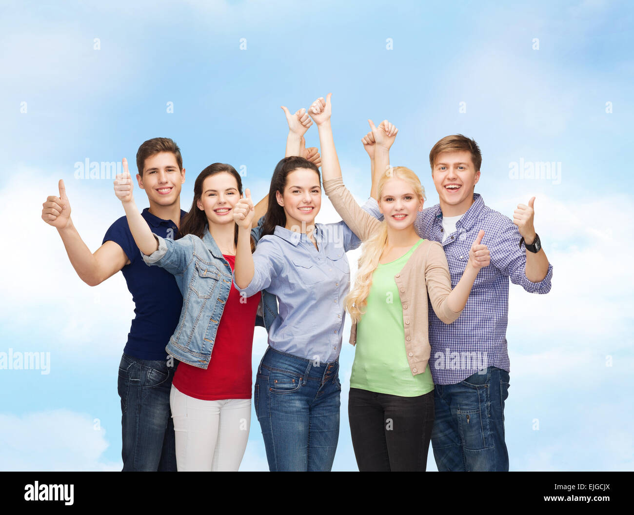 group of smiling students showing thumbs up Stock Photo - Alamy