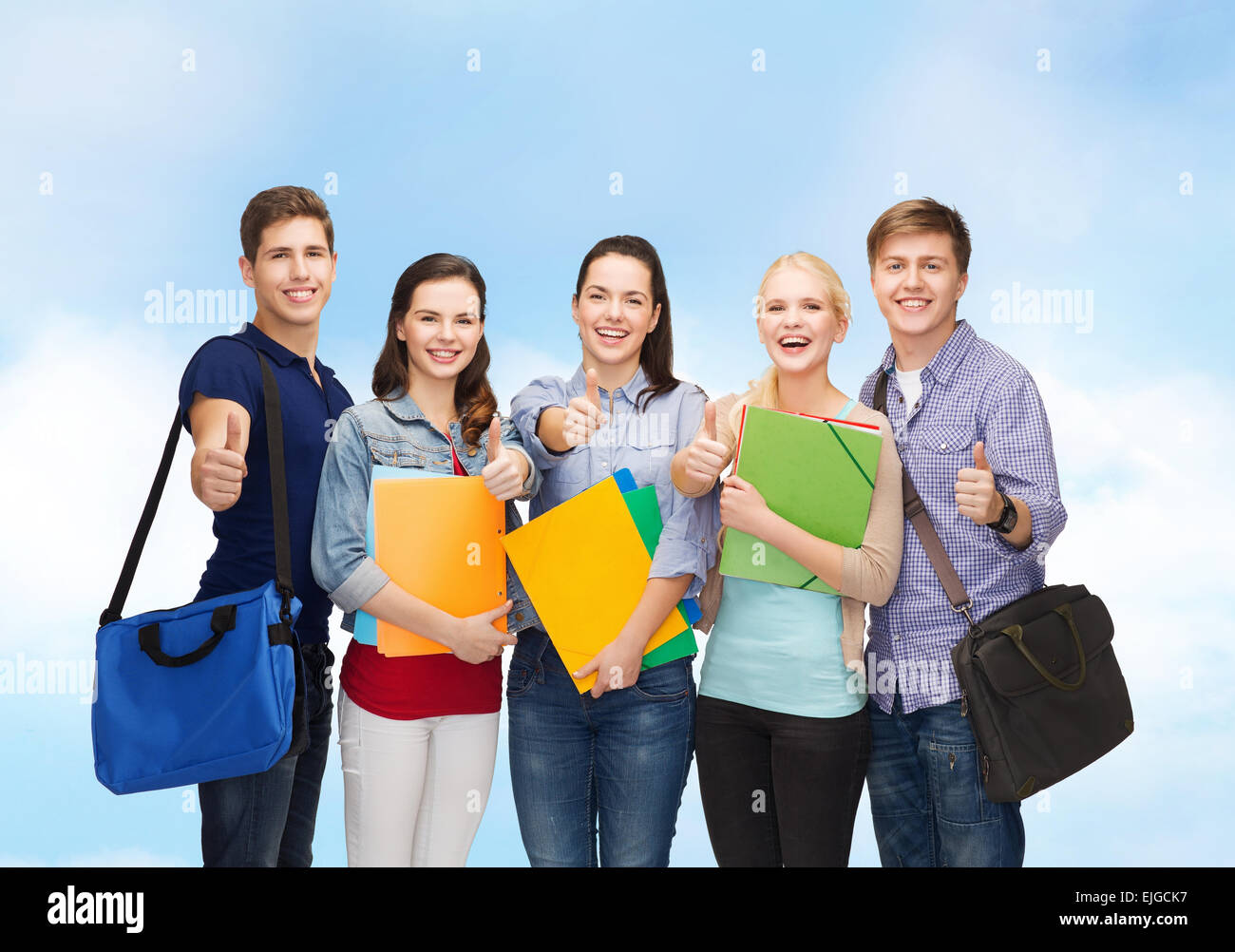 group of smiling students showing thumbs up Stock Photo - Alamy