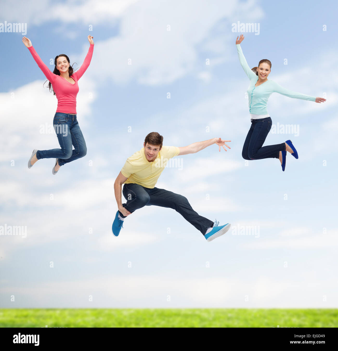 group of smiling teenagers jumping in air Stock Photo - Alamy