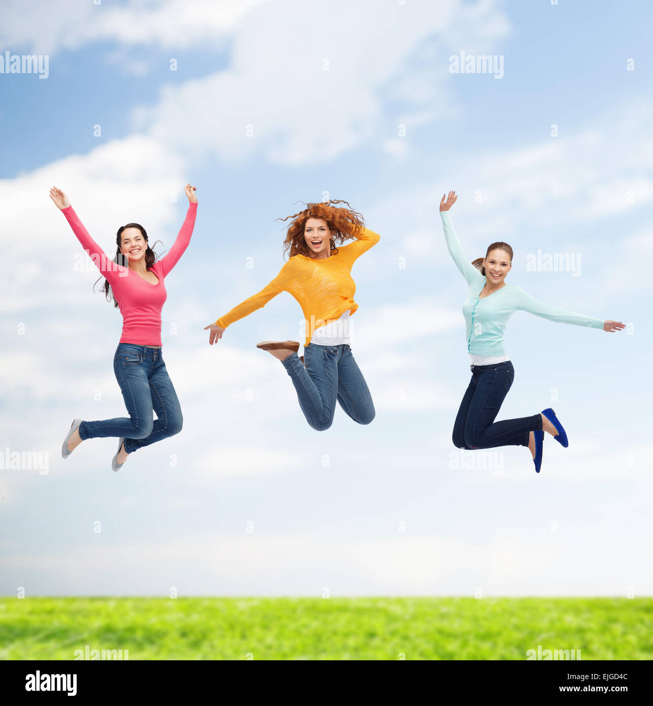 group of smiling young women jumping in air Stock Photo - Alamy