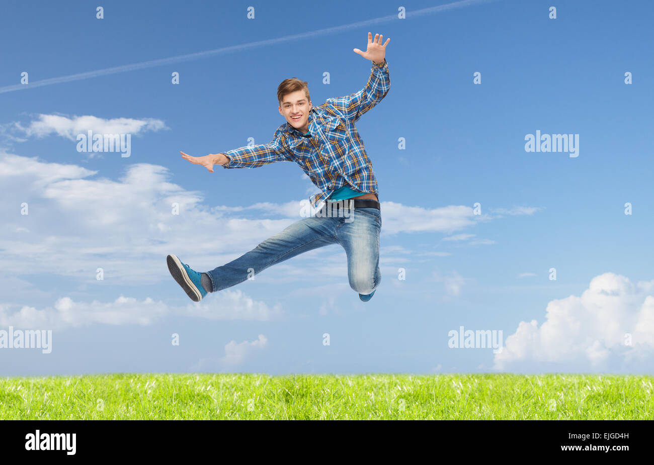 smiling young man jumping in air Stock Photo - Alamy