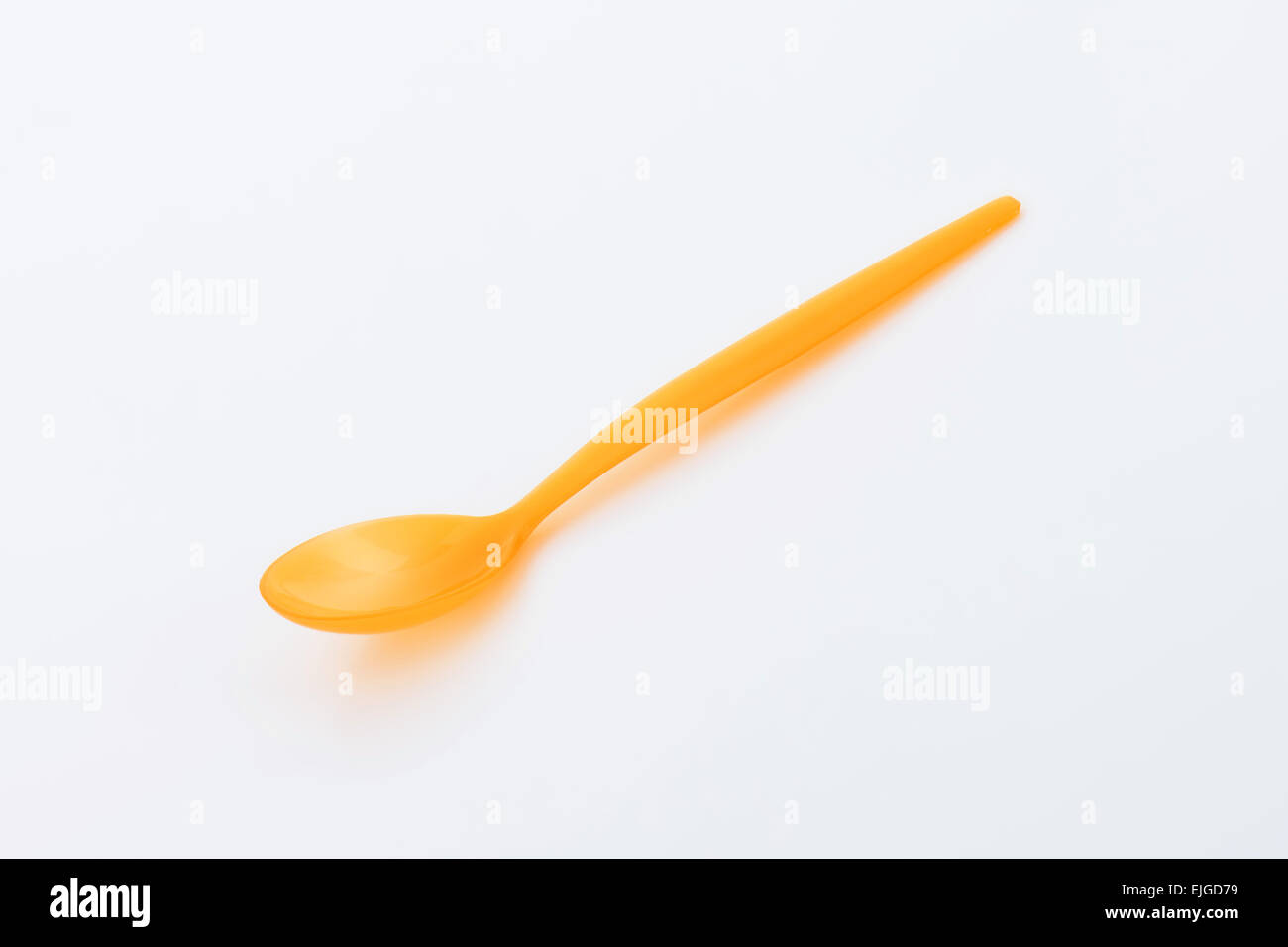 Orange plastic spoon for daily use Stock Photo - Alamy