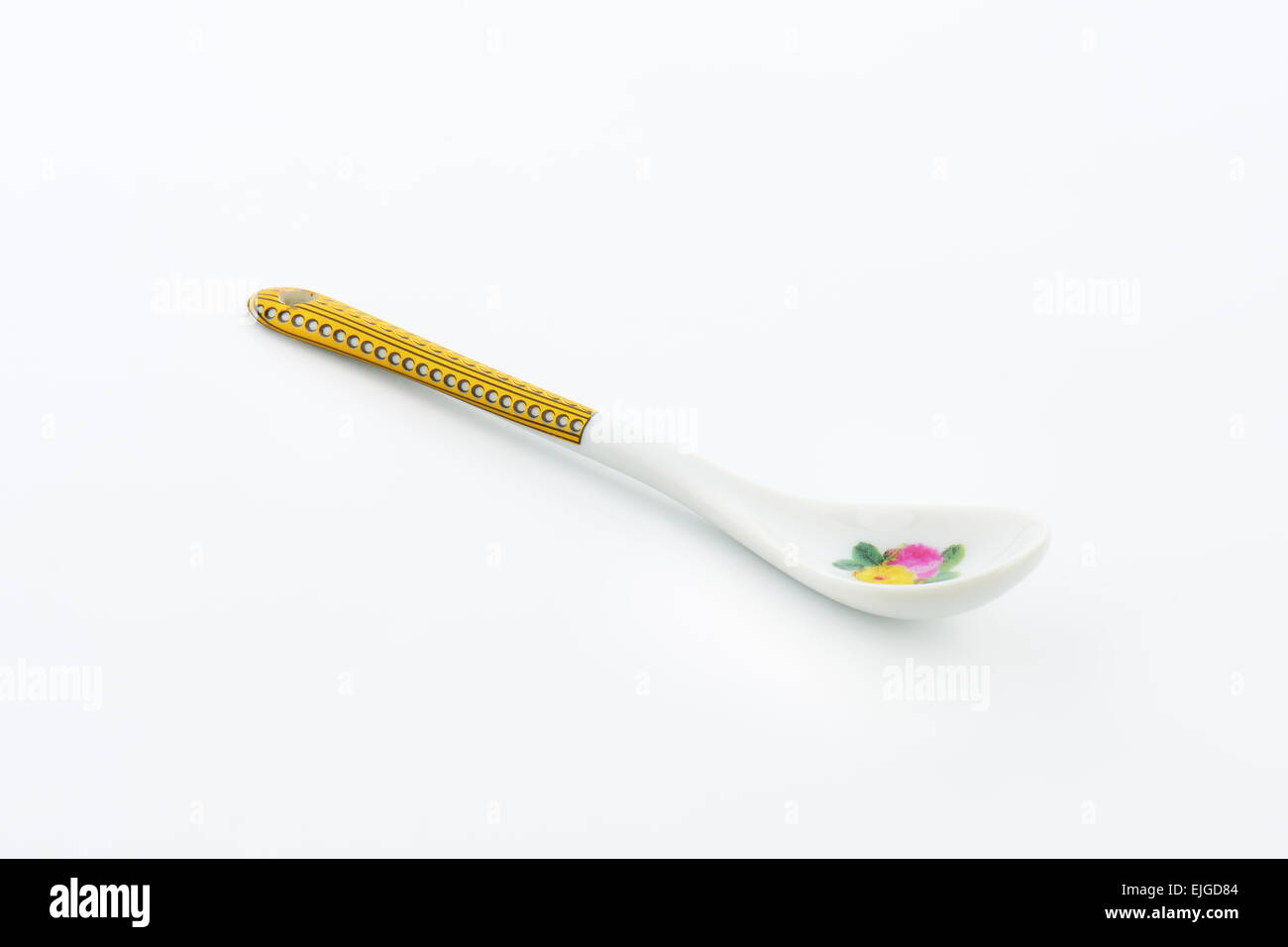 White spoon with floral and ornate print Stock Photo - Alamy