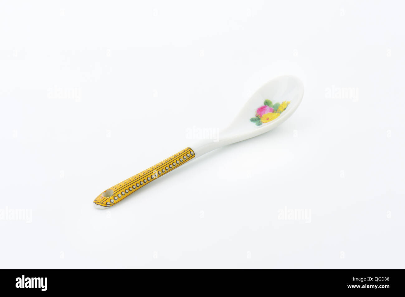 White spoon with floral and ornate print Stock Photo - Alamy