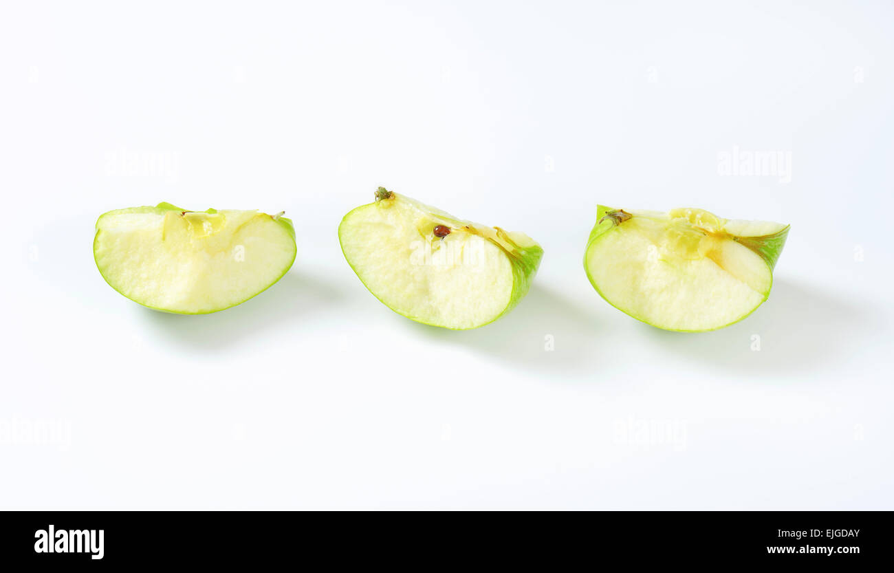 Fresh green apple wedges - studio shot Stock Photo - Alamy