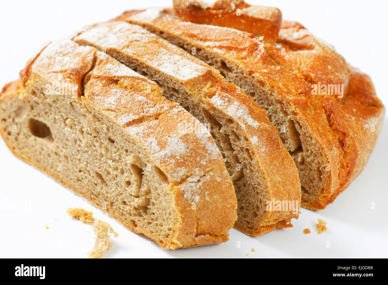 Sliced loaf of bread with crispy crust Stock Photo - Alamy
