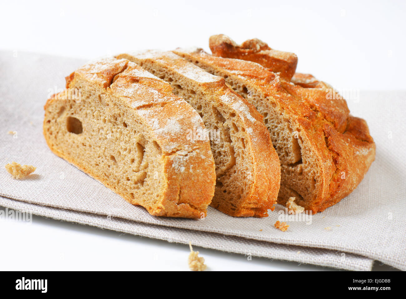 Sliced loaf of bread with crispy crust Stock Photo - Alamy