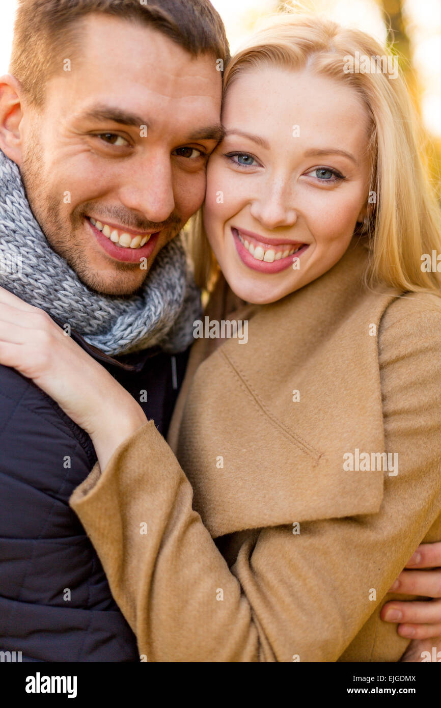 smiling couple hugging in autumn park Stock Photo - Alamy