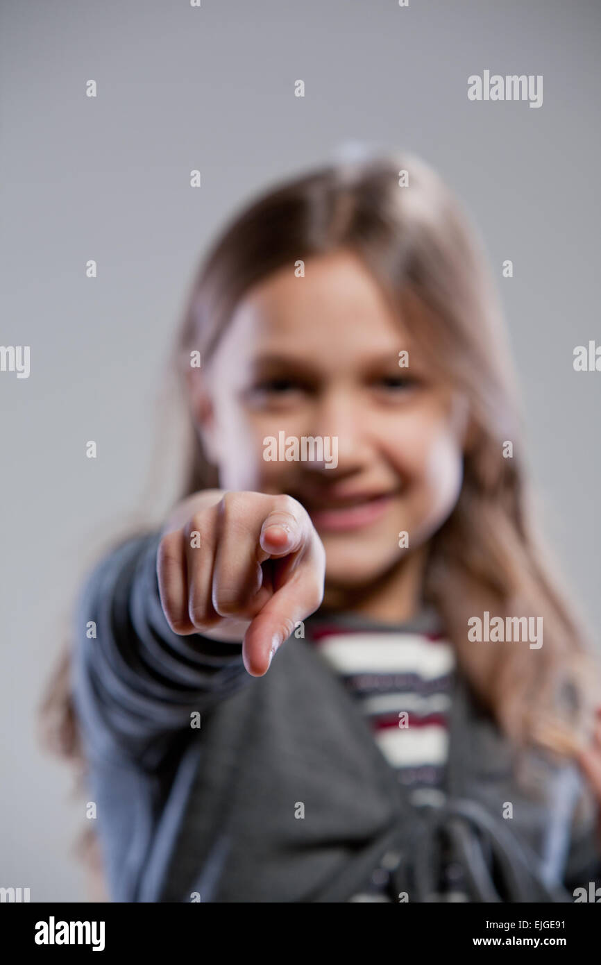little girl point ing out her finger (face blurred DOF Stock Photo - Alamy