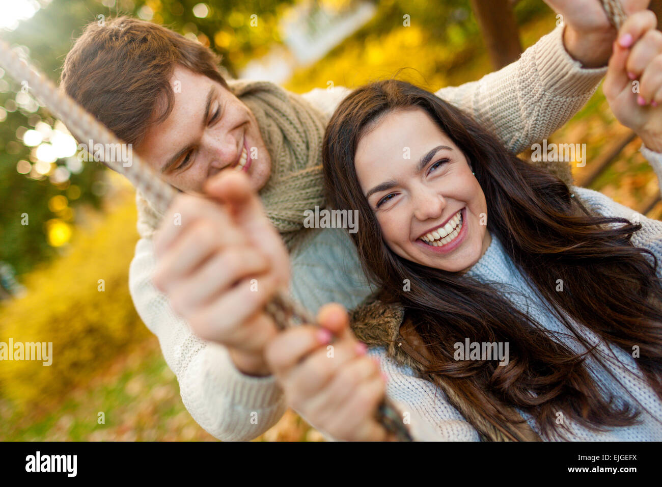 smiling couple hugging in autumn park Stock Photo - Alamy