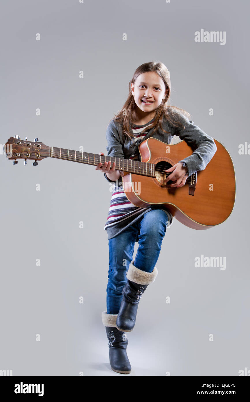 baby playing acoustic guitar Stock Photo - Alamy