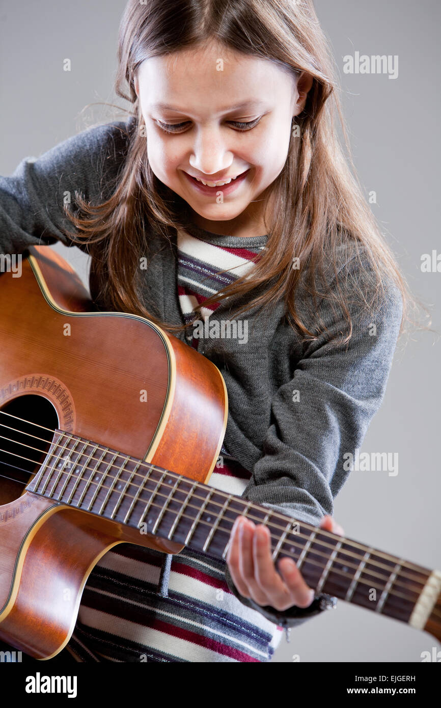 baby playing acoustic guitar Stock Photo - Alamy