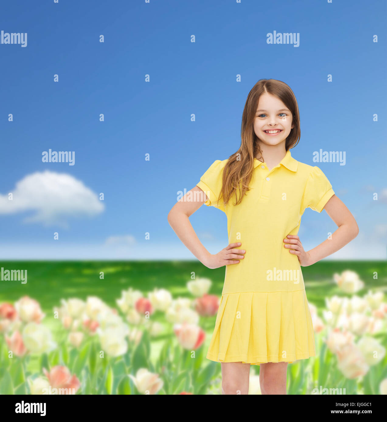 smiling little girl in yellow dress Stock Photo - Alamy