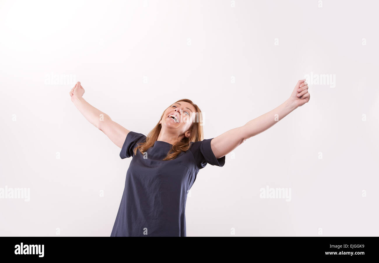 happy woman rising out her arms embracing the love for joy and life ...