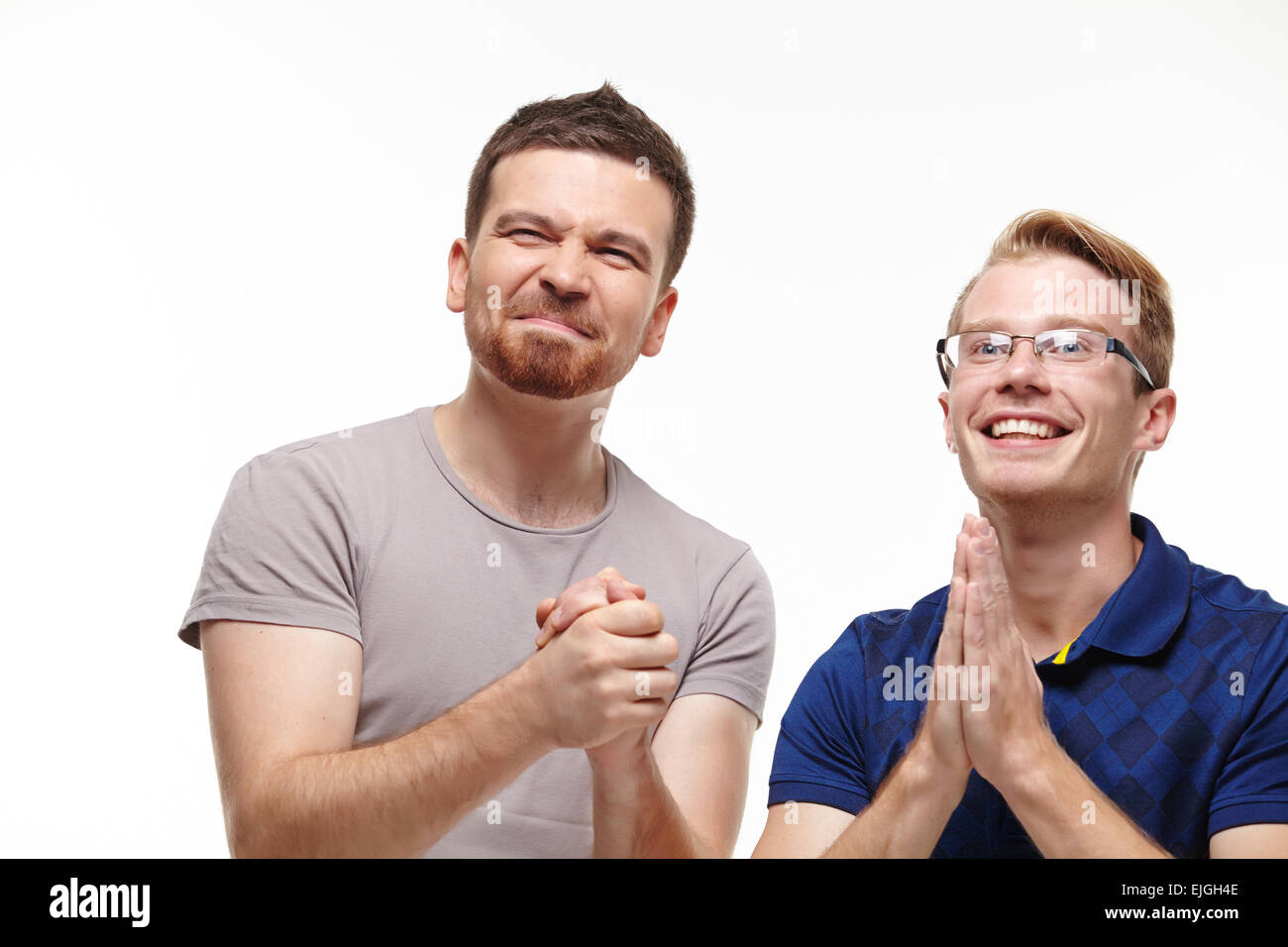 Two young men watching the competition Stock Photo - Alamy
